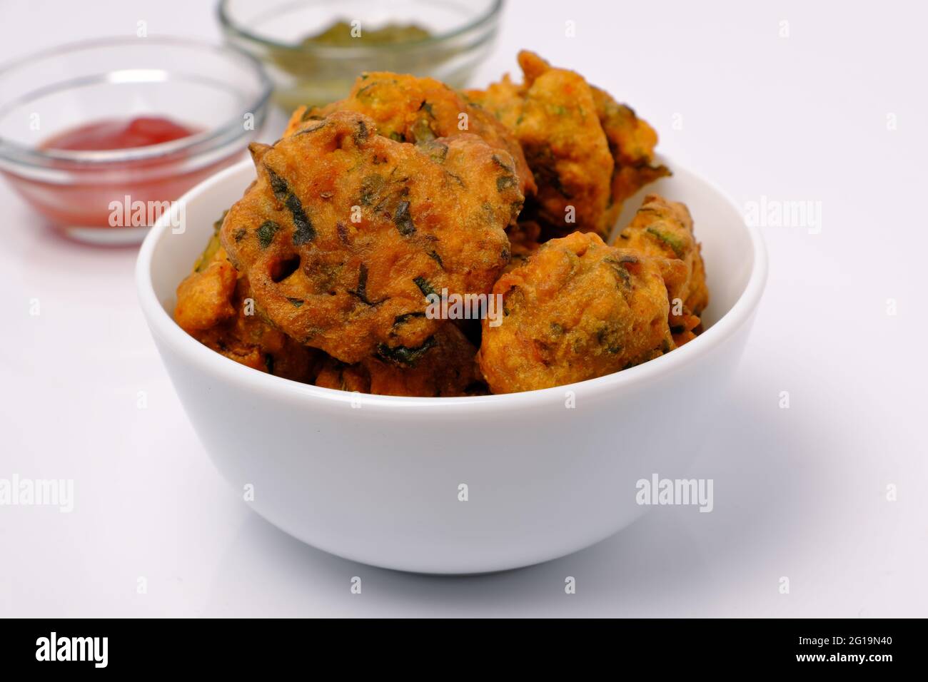Indian snack pakora with tomato sauce or chutney Stock Photo - Alamy