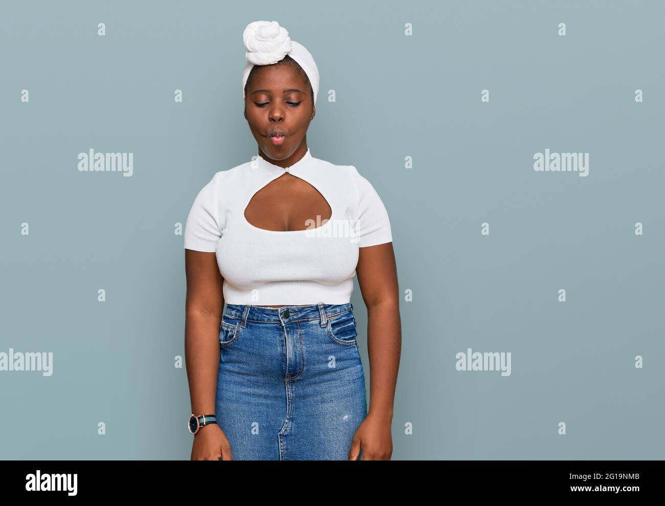 Young african woman with turban wearing hair turban over isolated ...