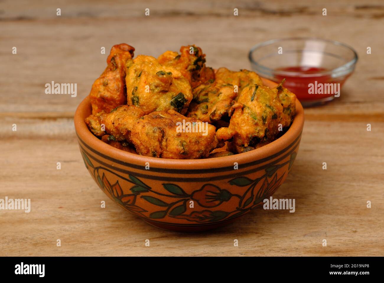 Indian snack pakora with tomato sauce or chutney Stock Photo - Alamy