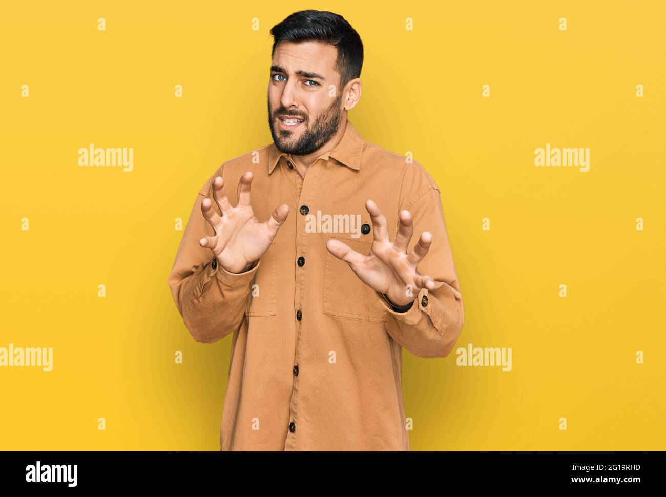 Young hispanic man wearing casual clothes disgusted expression ...