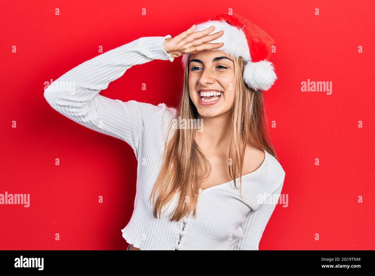 Beautiful hispanic woman wearing christmas hat very happy and smiling ...