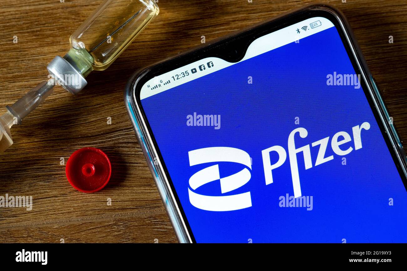 In this photo illustration a Pfizer logo seen displayed on a smartphone ...