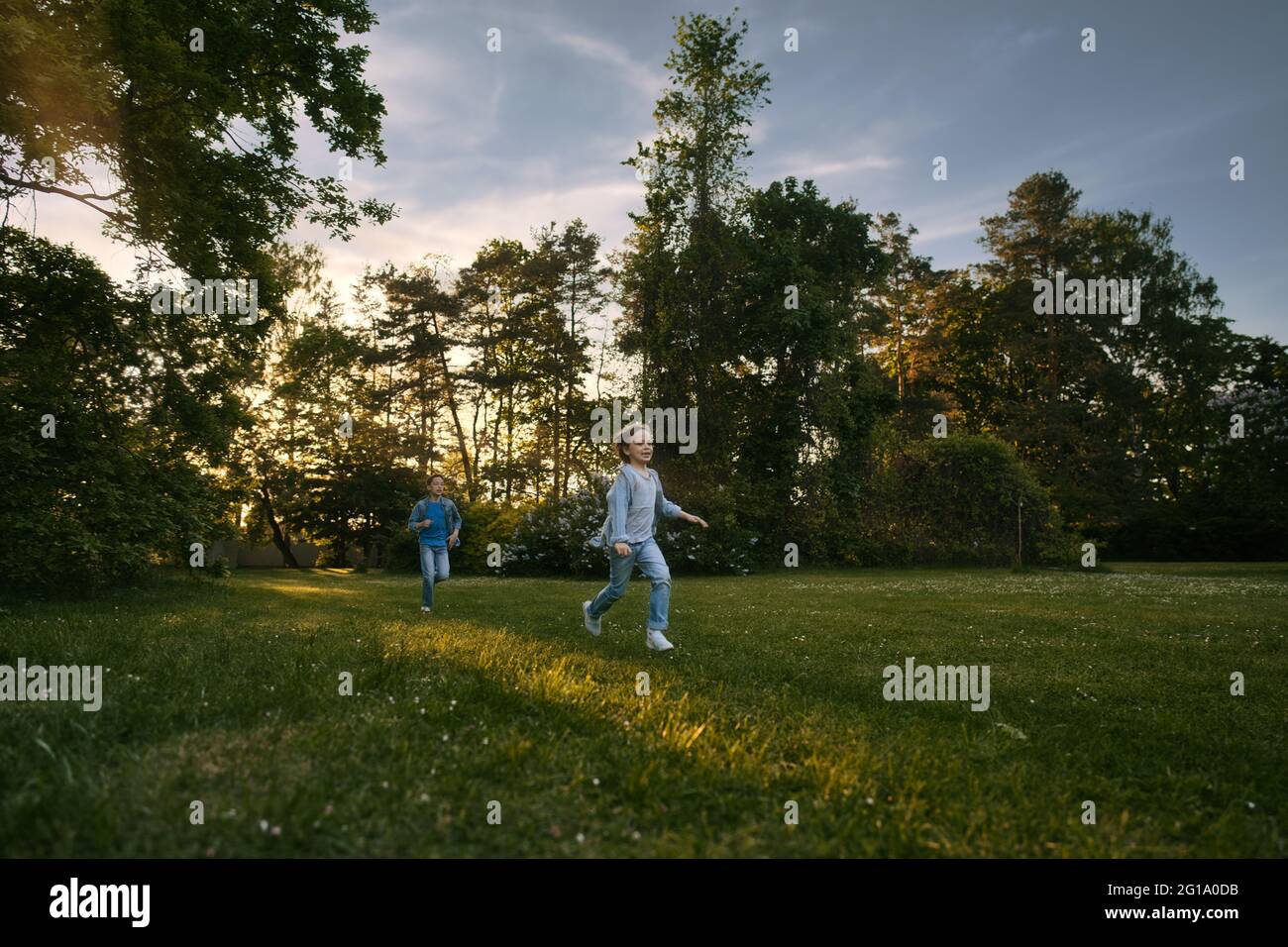 Two boys running forest hi-res stock photography and images - Alamy