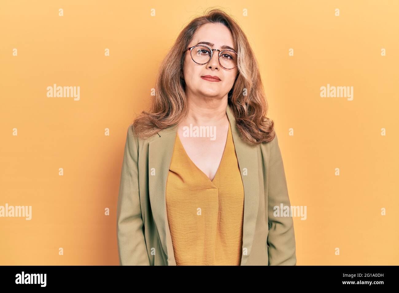 Middle age caucasian woman wearing casual clothes with serious ...