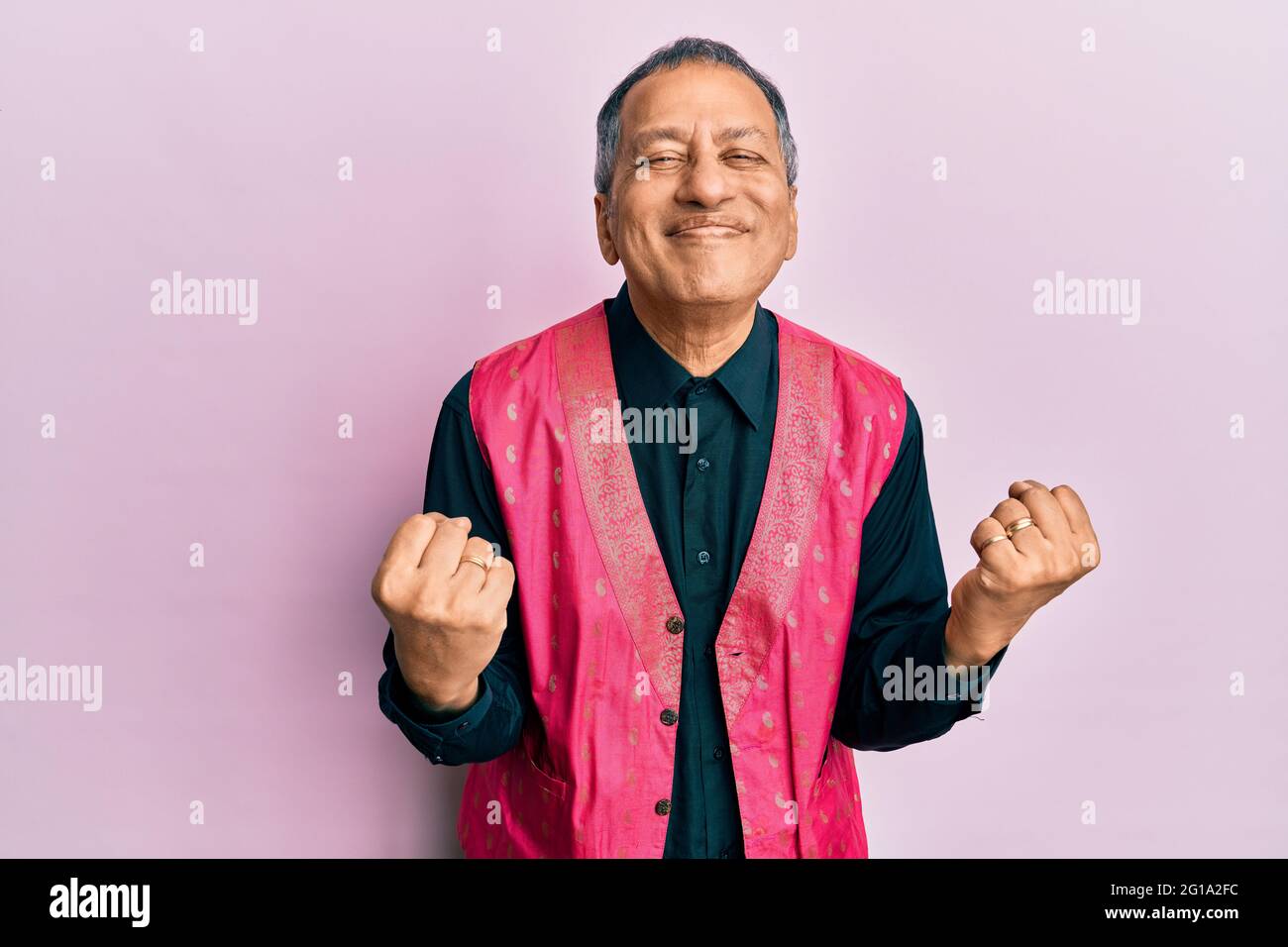 Middle age indian man wearing traditional indian clothes very happy and ...
