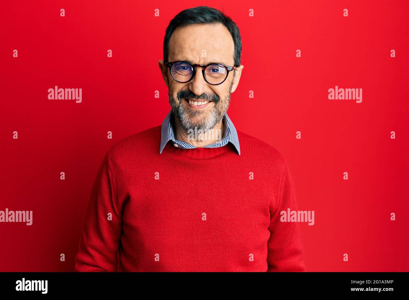Middle age hispanic man wearing casual clothes and glasses with a happy ...