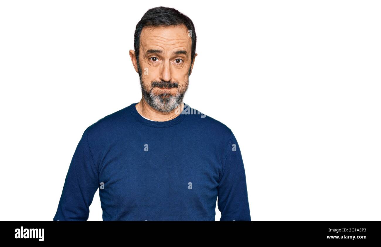 Middle age hispanic man wearing casual clothes puffing cheeks with ...