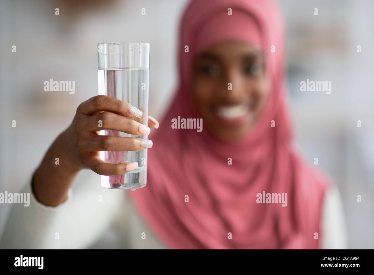 Woman drink glass water smiling home hi-res stock photography and ...