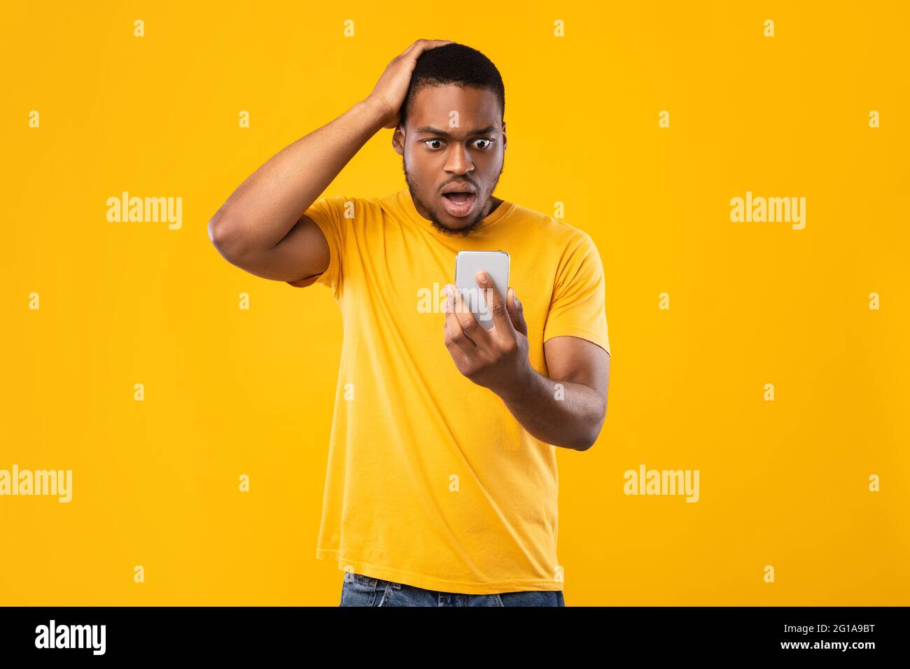 Concerned man yellow background hi-res stock photography and images - Alamy