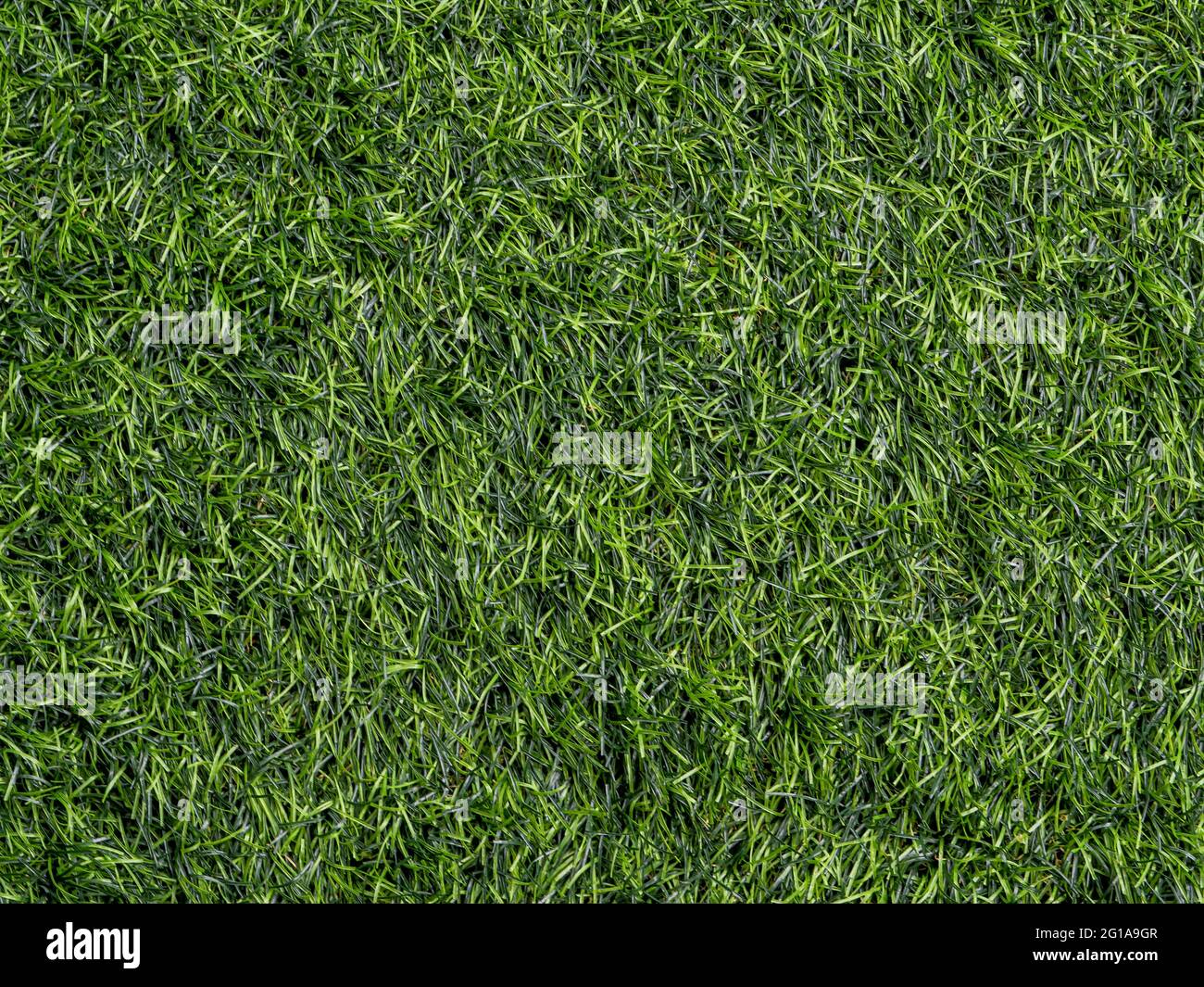 Texture of plastic artificial grass of school yard Stock Photo - Alamy