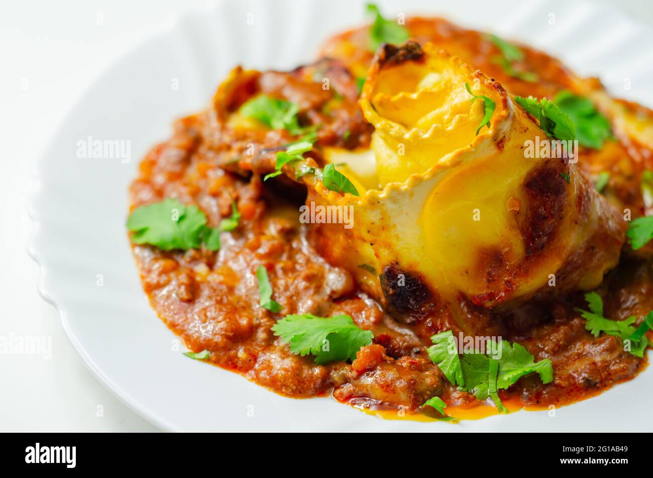 Hand rolled four cheese ravioli pasta in minced beef with Chianti red ...