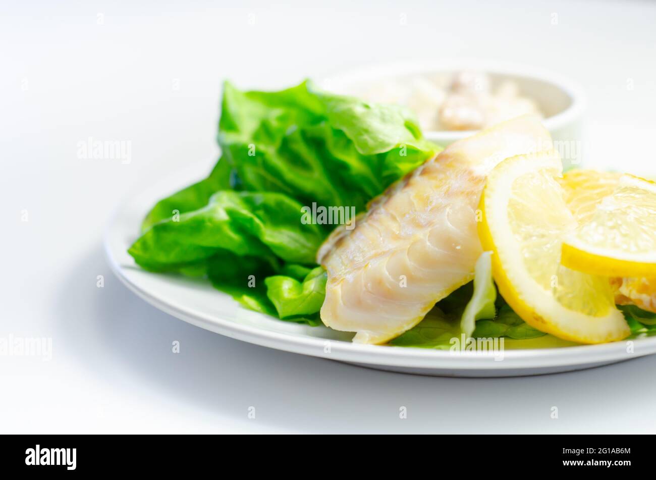 Steamed haddock fillet served with an exquisite salad consisting of ...