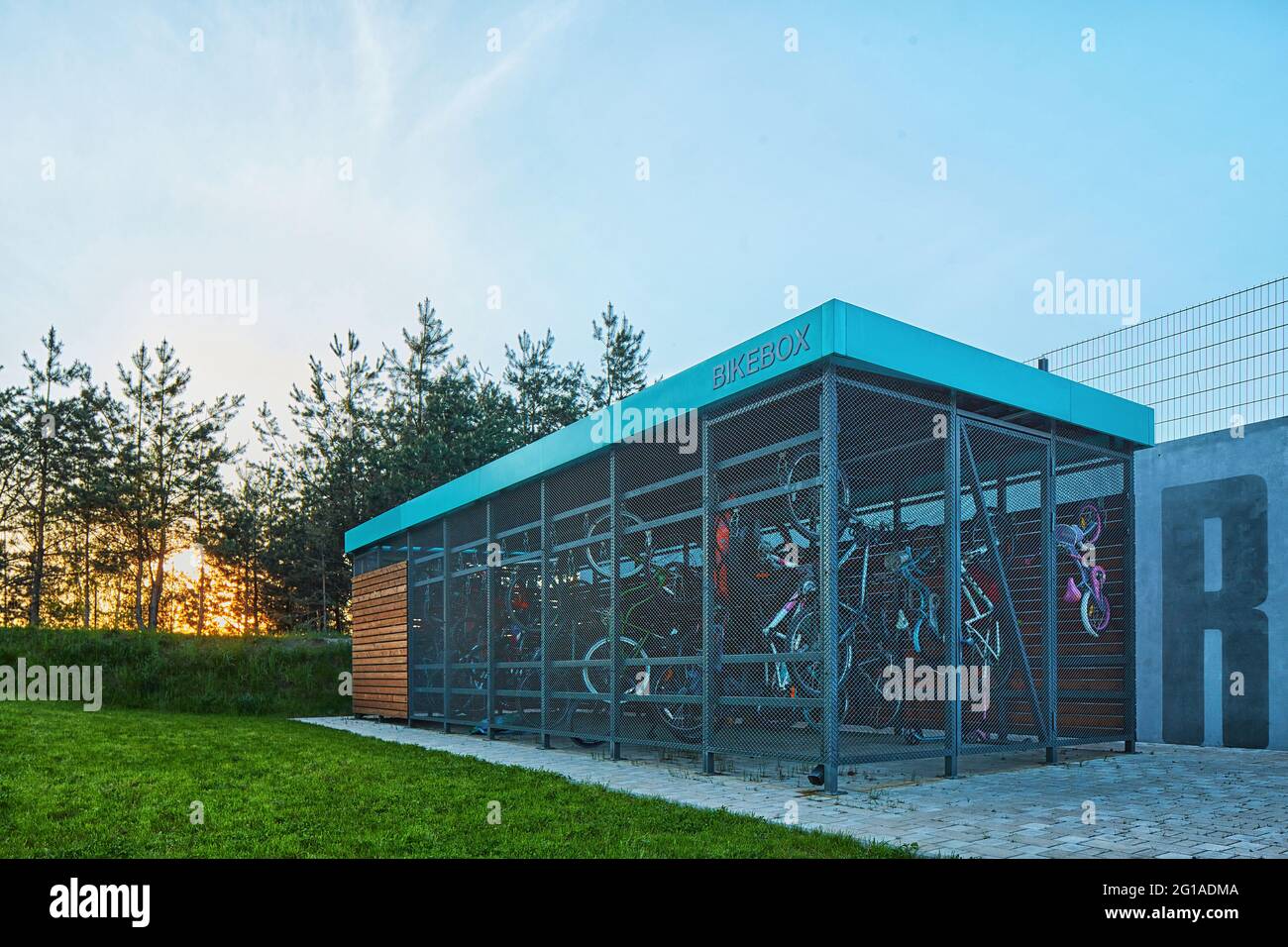 Outdoor roofed guarded bicycle storage. Modern parking space in ...