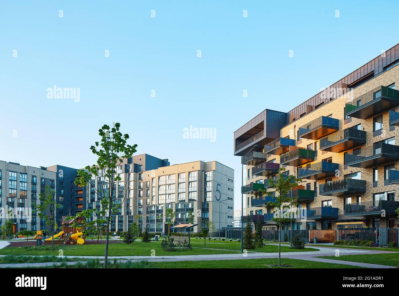 New modern block of flats in green area. residential apartment with ...