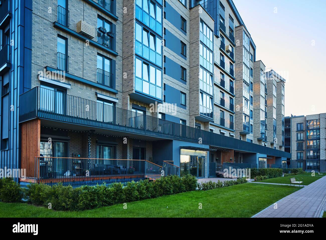 New modern block of flats in green area. residential apartment with ...