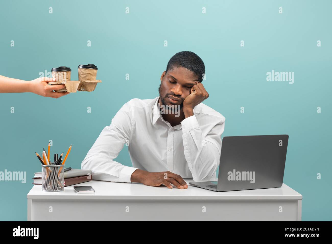 Exhausted black male employee needing coffee, businessman sleeping at ...