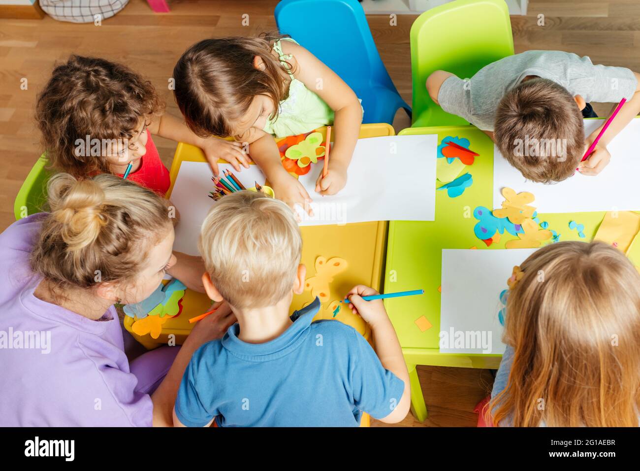 Top view kindergarten children during art lesson Stock Photo - Alamy
