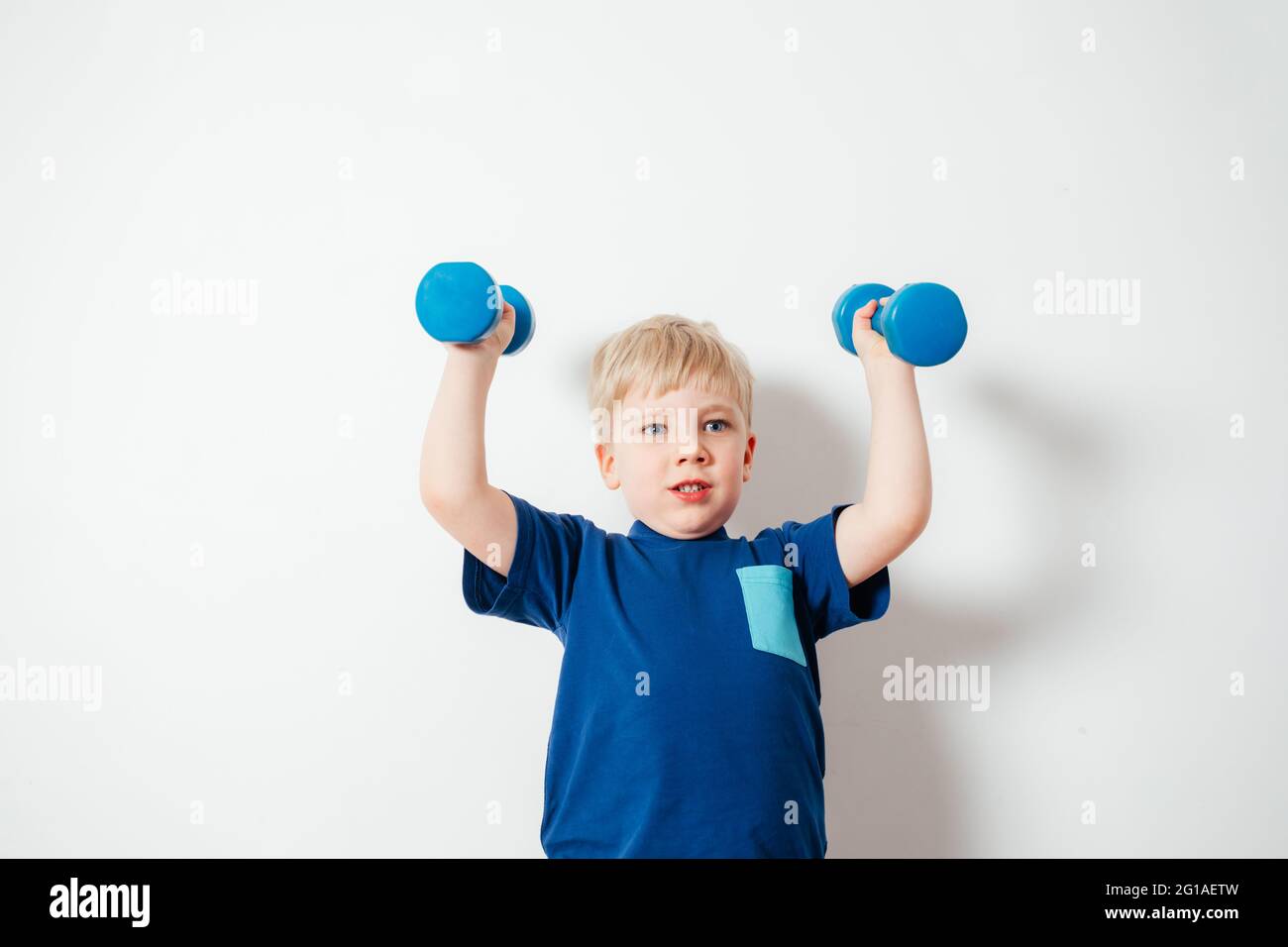 Active kids doing sport by following parents example Stock Photo - Alamy