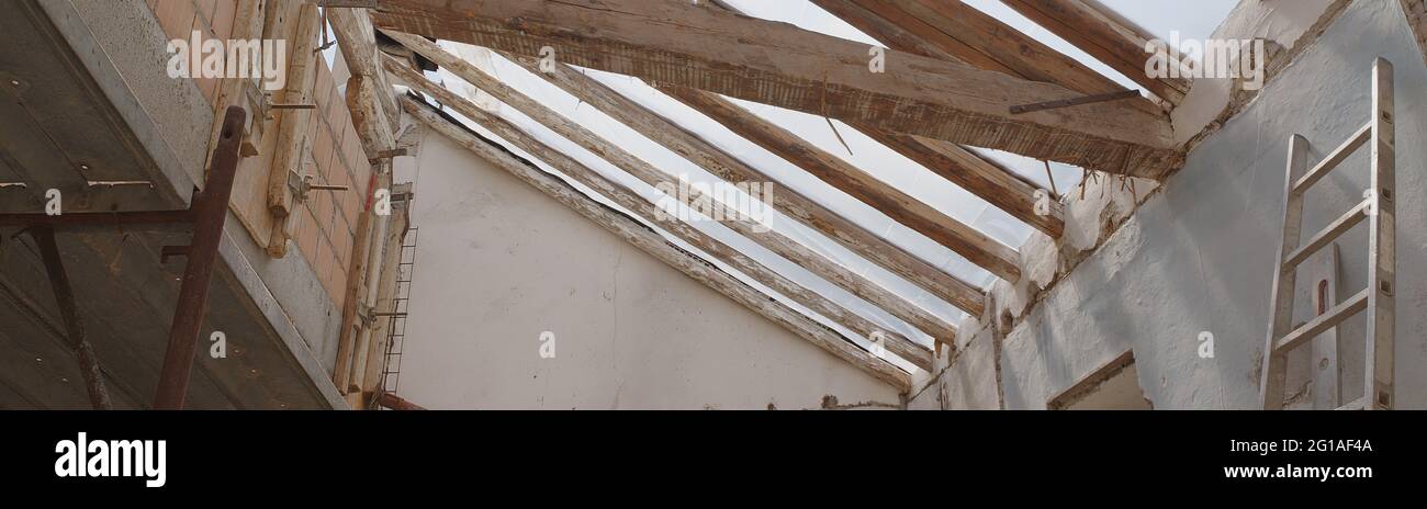 construction building site with the wooden old beams roof, reinforced ...
