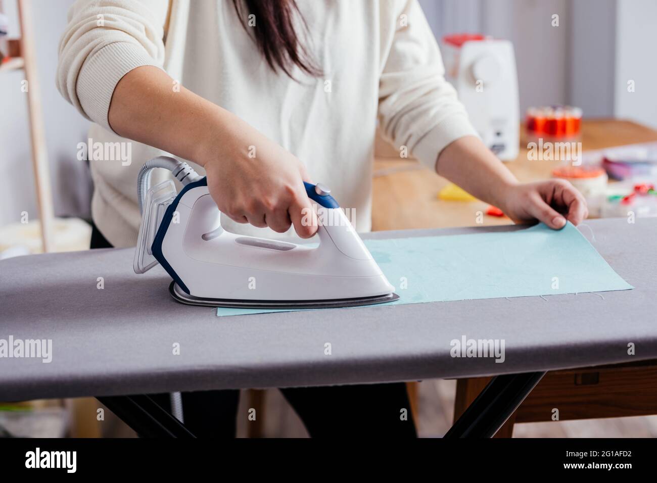 Process of ironing textile before cutting the pattern and sewing Stock ...