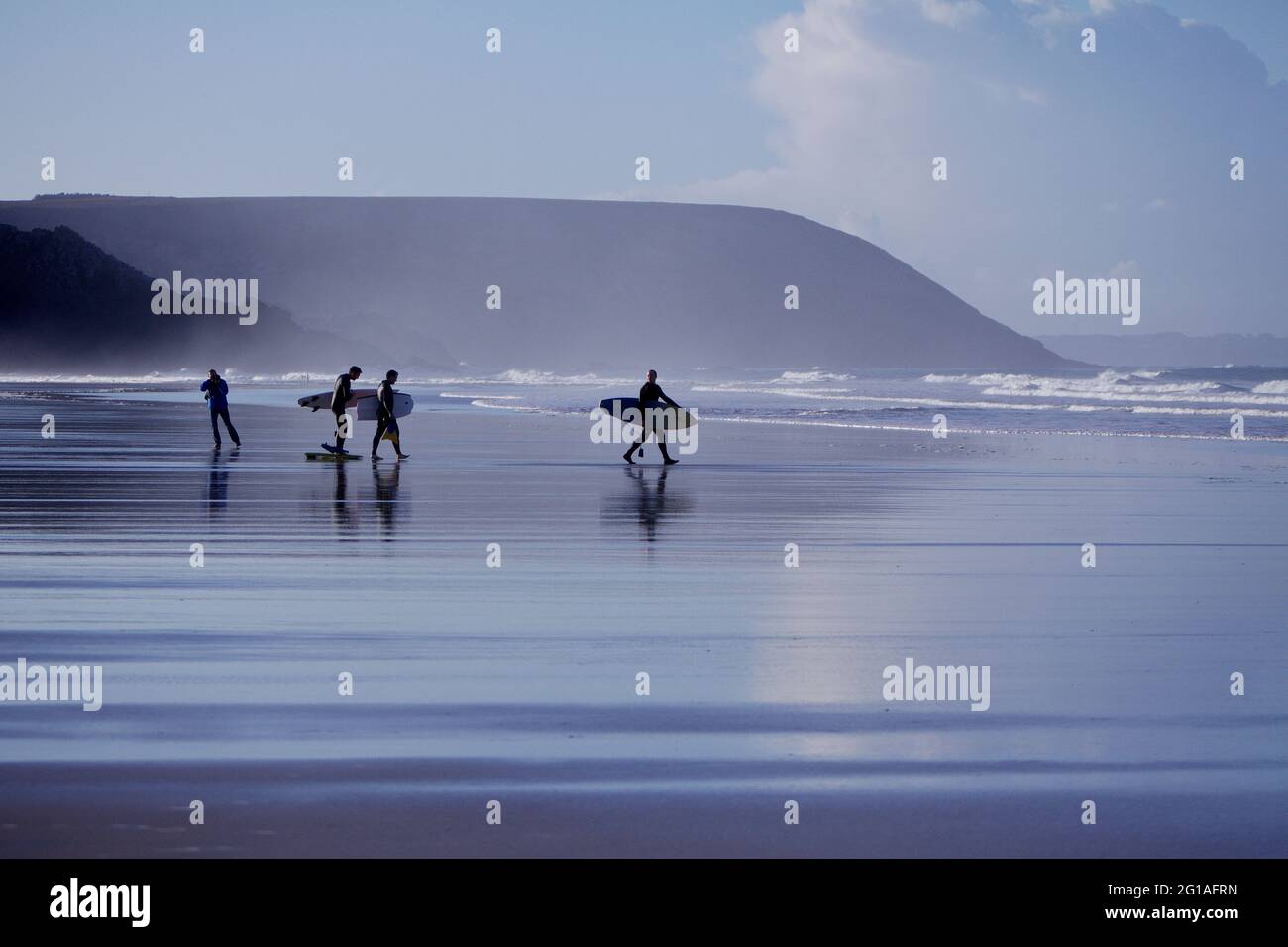 Three surfers going for surfing with their own photograph Stock Photo ...