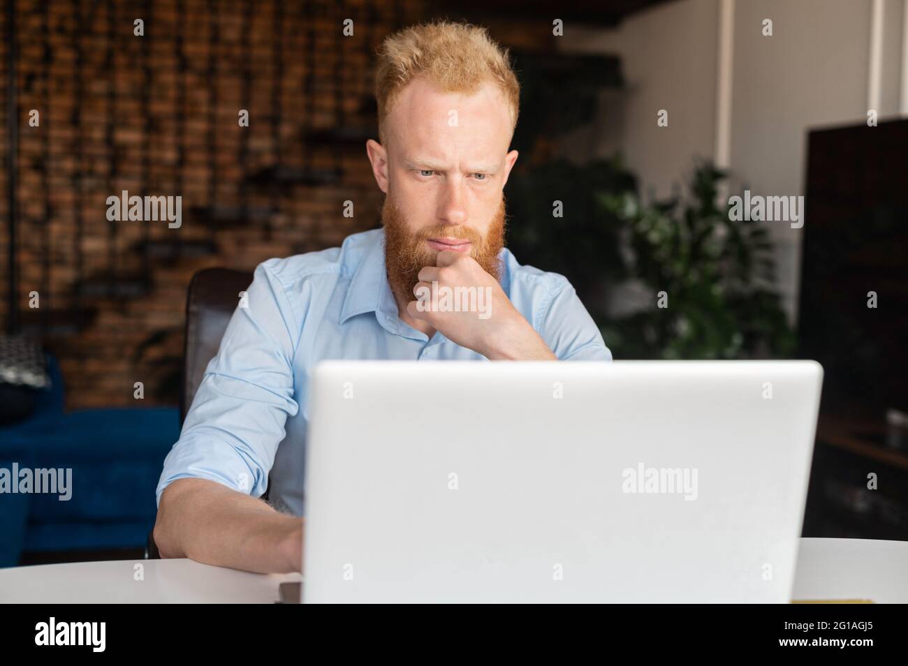 Serious guy staring computer monitor hi-res stock photography and ...