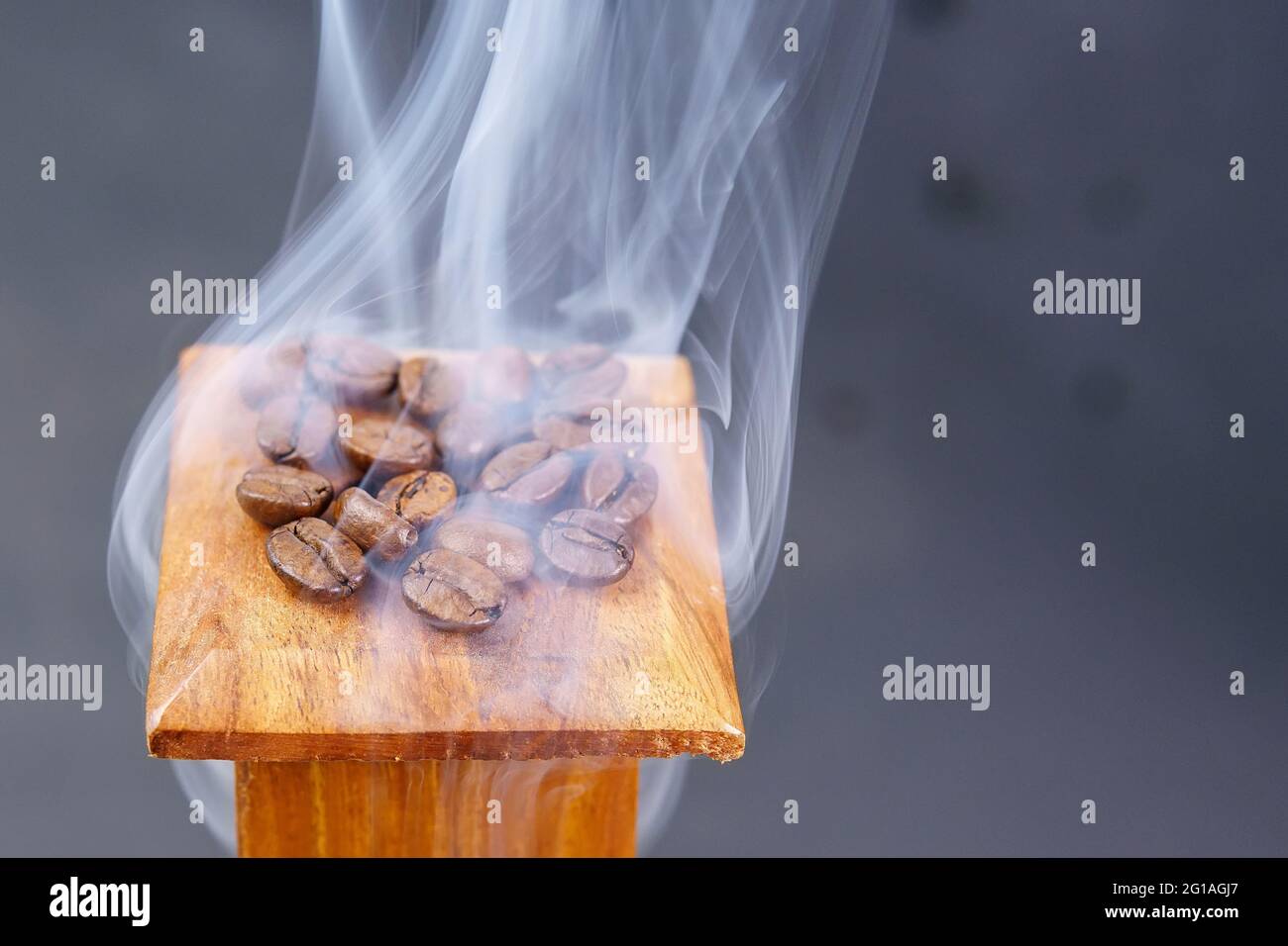 Fragrant coffee beans, smoke comes from coffee beans. selective focus ...