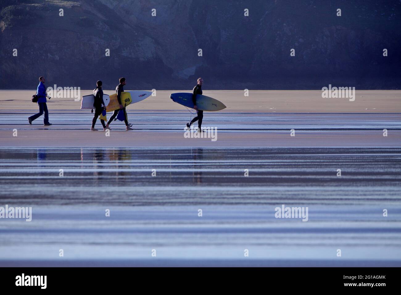 Three surfers going for surfing with their own photograph Stock Photo ...