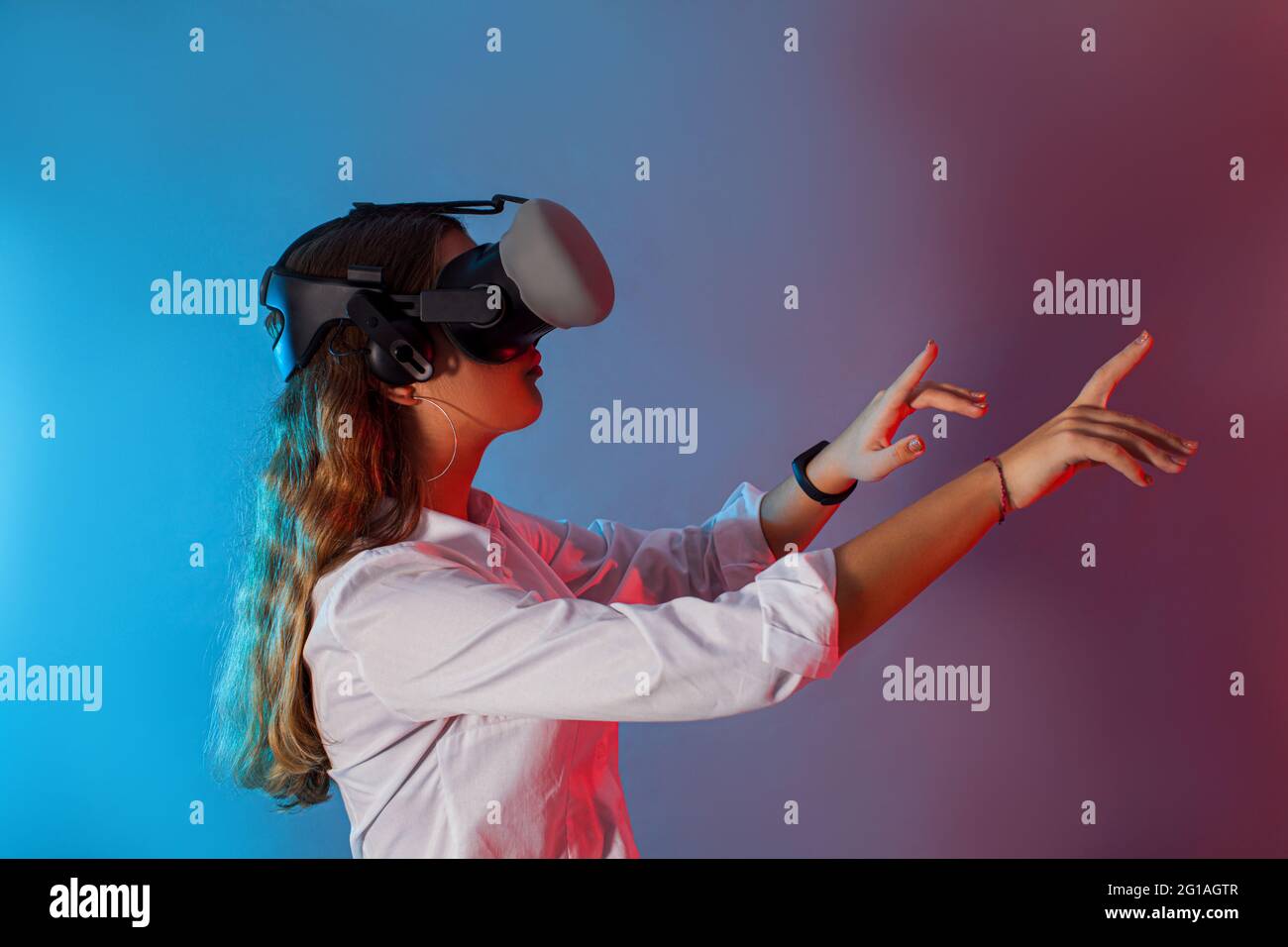 Couple using a gaming gadget for virtual reality Stock Photo - Alamy