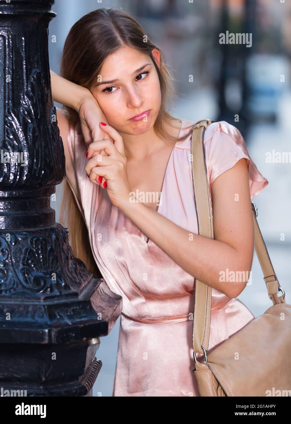 sad girl standing outside in city Stock Photo - Alamy