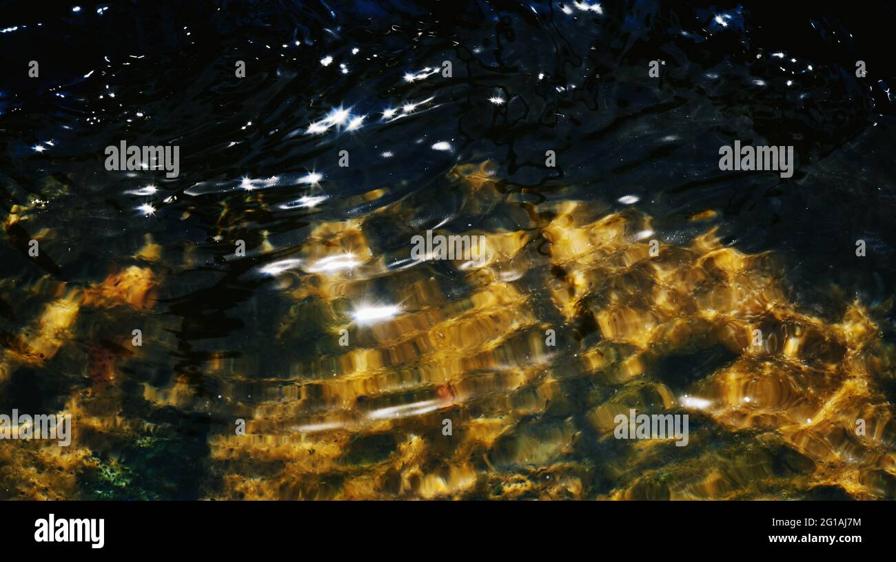 The ripples and sunlight reflection on the water surface Stock Photo ...