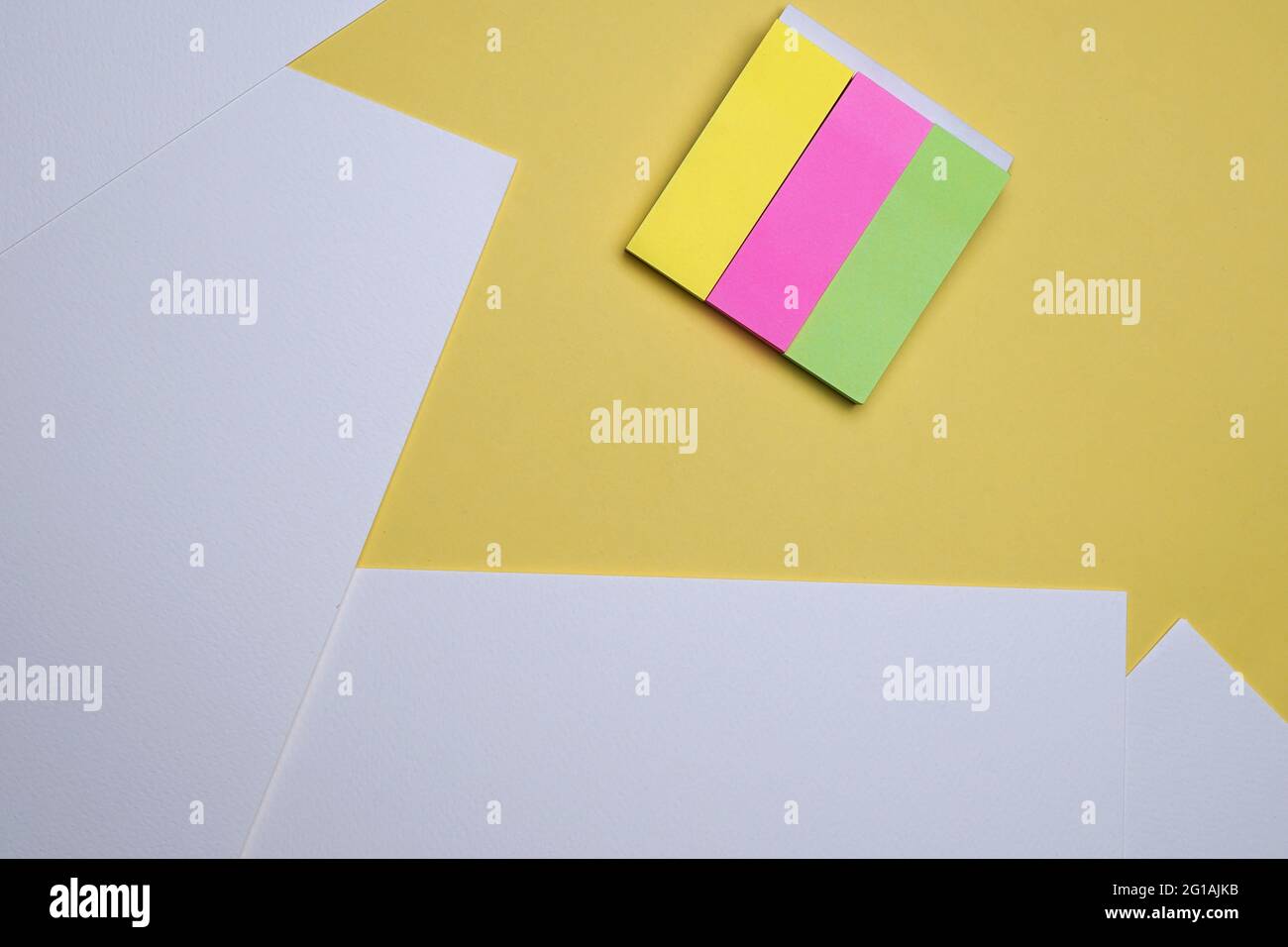 Creative Student, homework flat lay, table top. White sheets and sticky ...