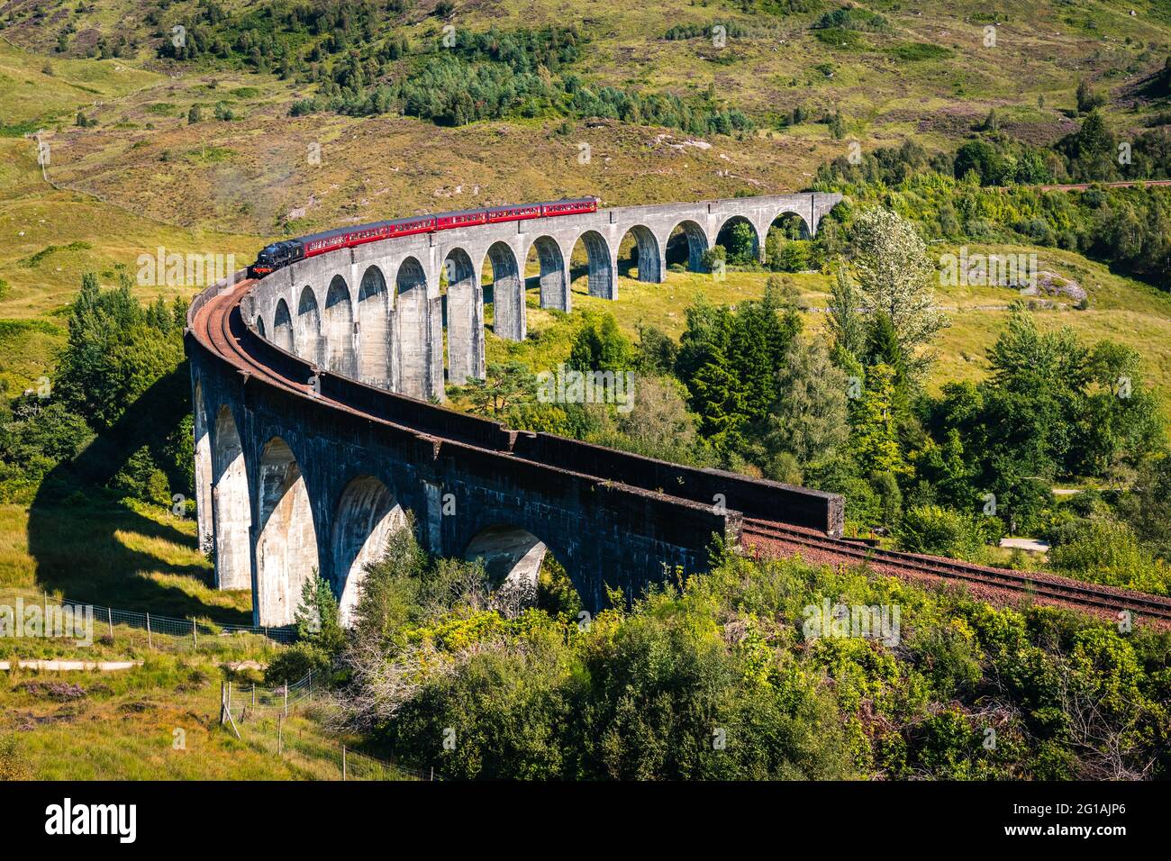 An aerial view of Glenfinnan Viaduct, a concrete archway in the ...
