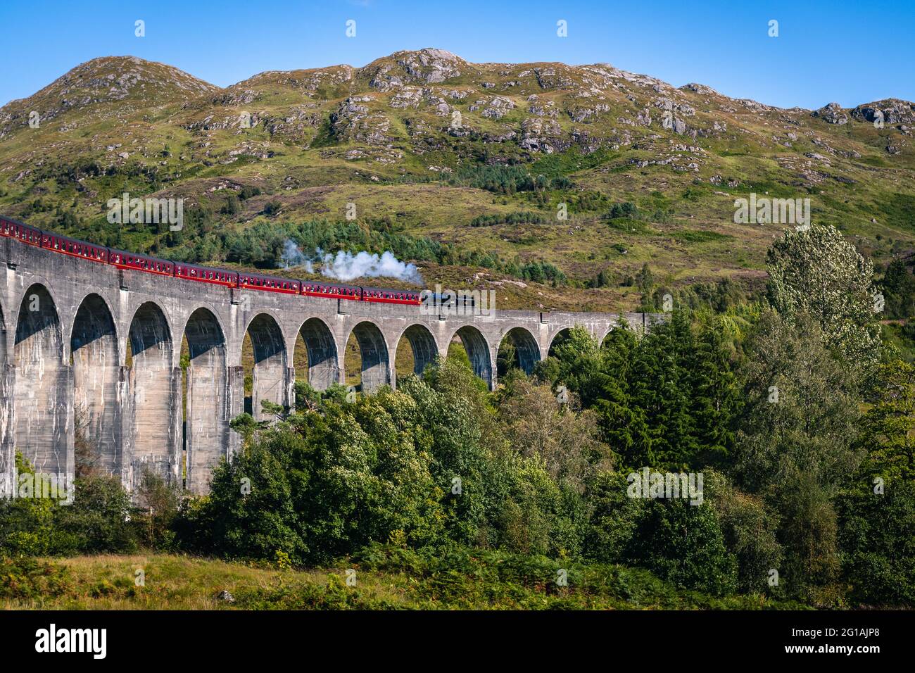 An aerial view of Glenfinnan Viaduct, a concrete archway in the ...