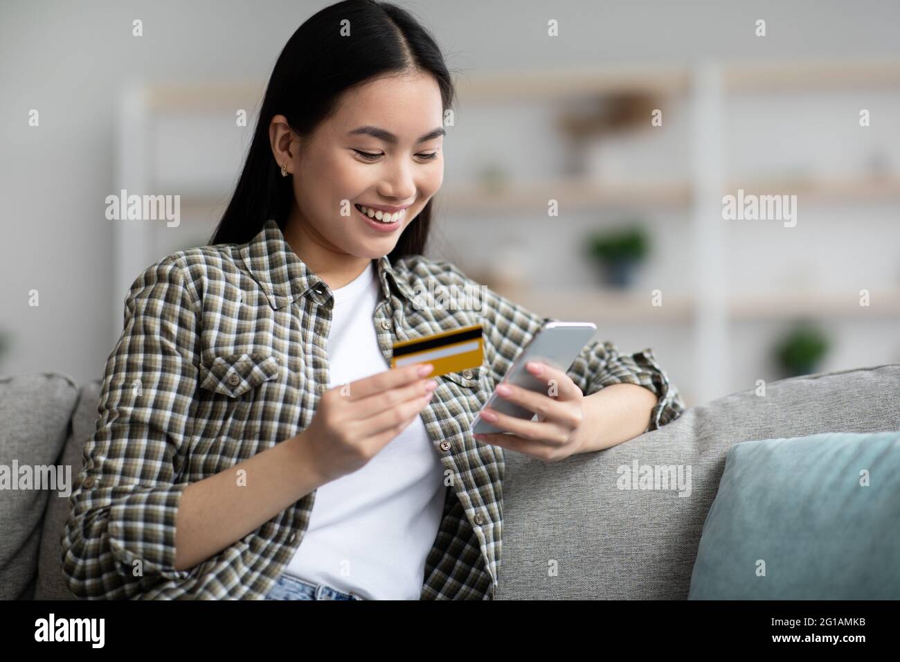 Chinese woman holding smartphone hi-res stock photography and images - Alamy