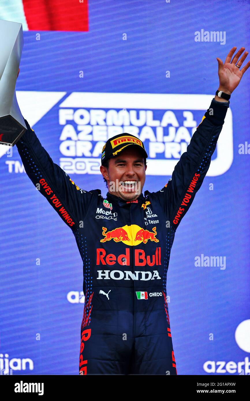 Race winner Sergio Perez (MEX) Red Bull Racing celebrates on the podium ...