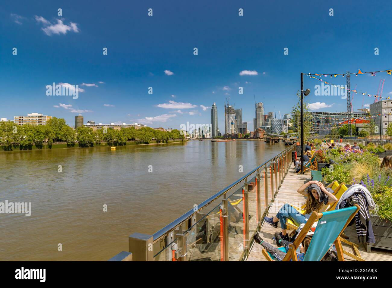 People enjoying the sunshine on The Coaling Jetty ,a grade II listed ...