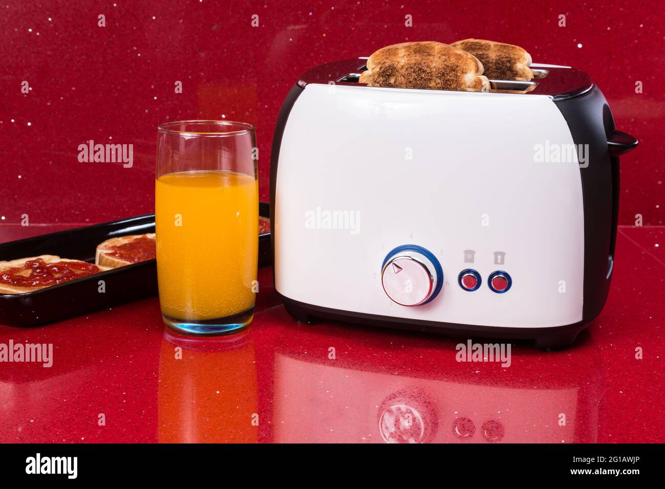Modern design of the bread toaster in the red kitchen interior Stock ...