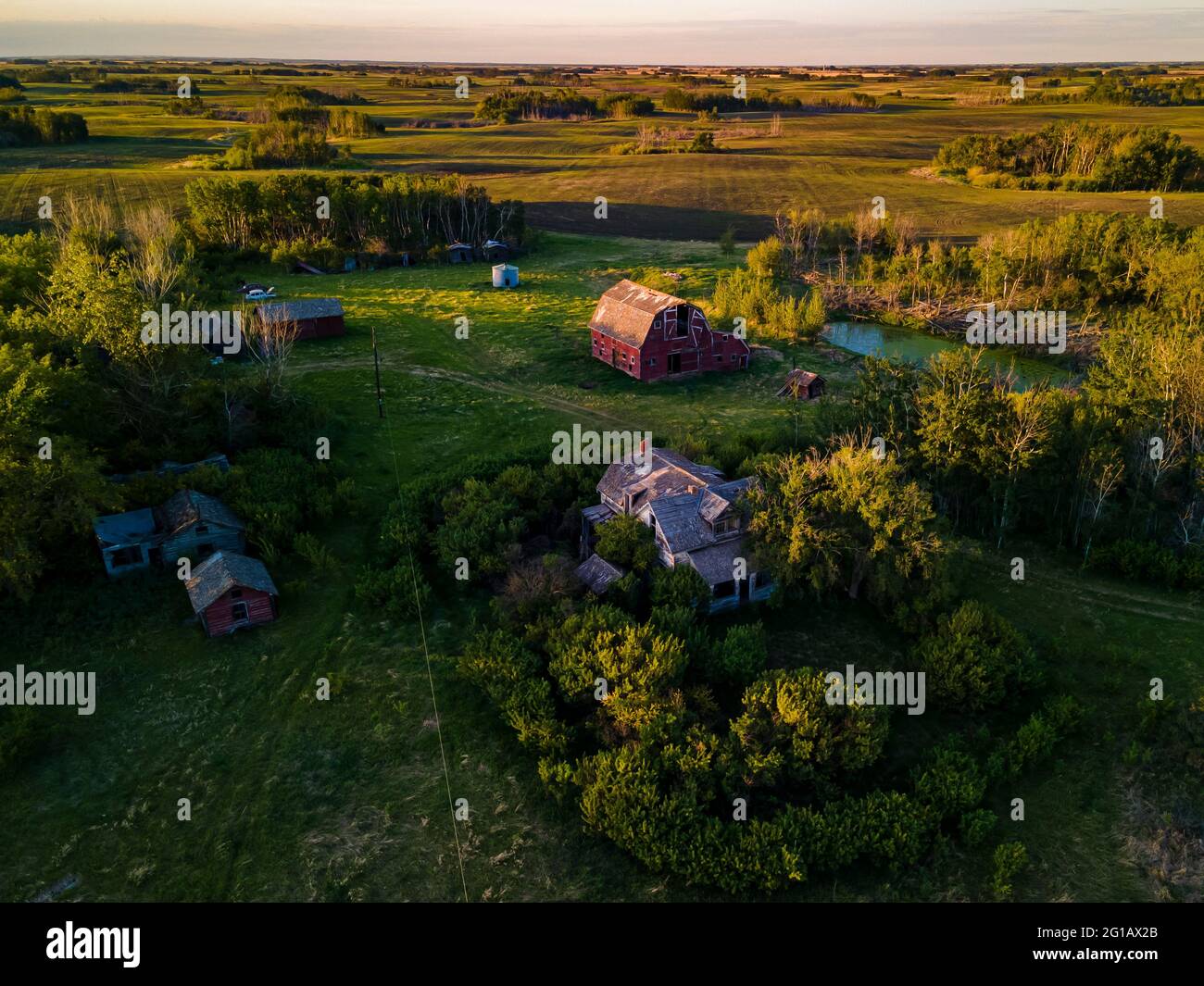 An aerial view of an old farm yard that has been abandoned, forgotten ...