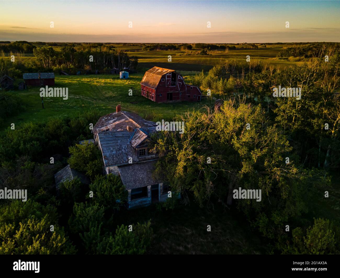 An aerial view of an old farm yard that has been abandoned, forgotten ...