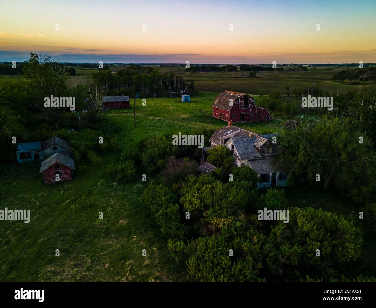 An aerial view of an old farm yard that has been abandoned, forgotten ...