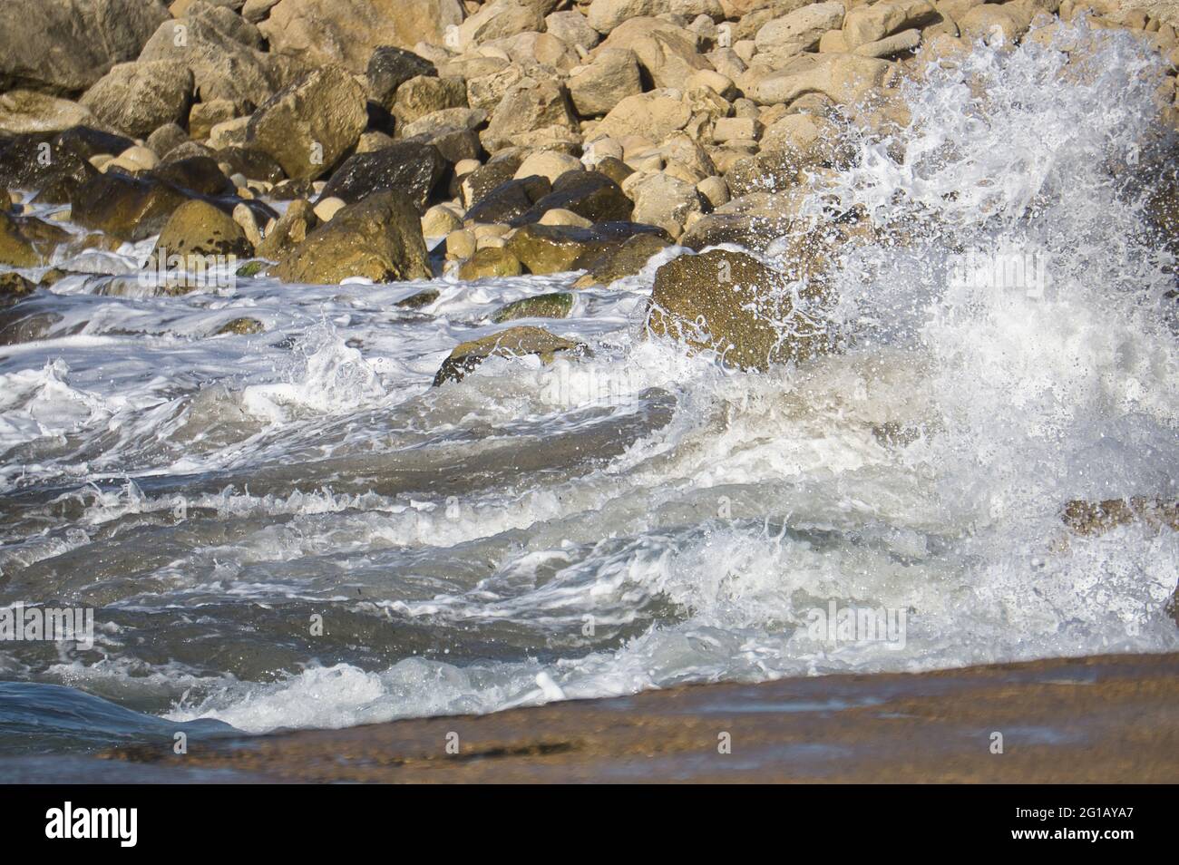 Aerial view waves crashing rocks hi-res stock photography and images ...