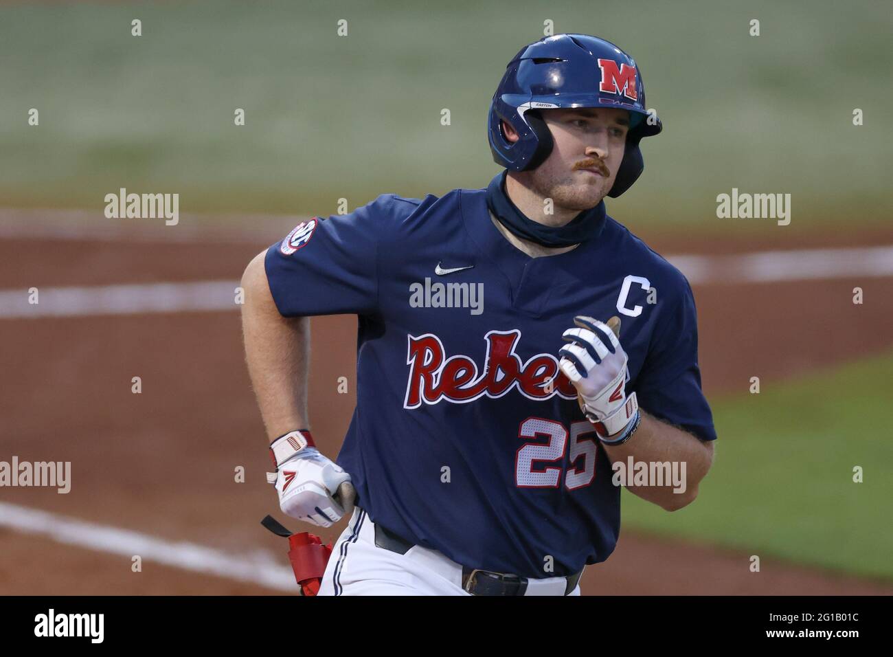 June 04, 2021: Ole Miss infielder Tim Elko (25) rounds first after ...