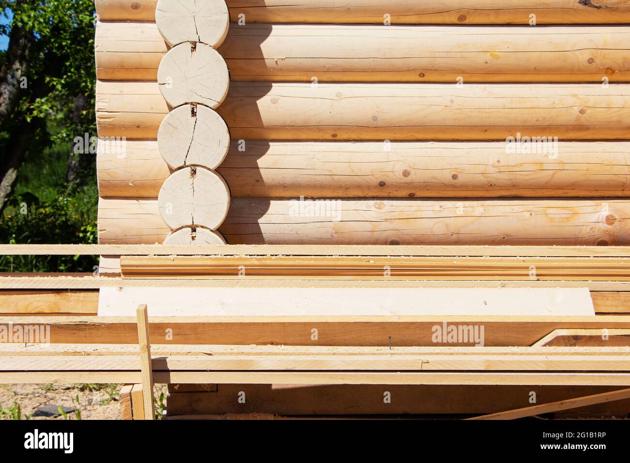 the house is built of round logs. Close-up of the corner of the house ...