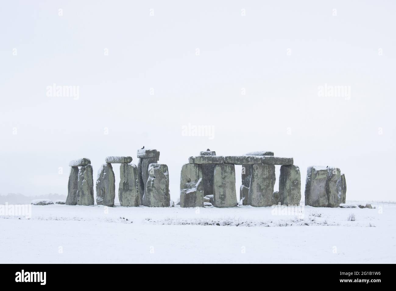 A close-up of the mist and winter snow encircling the isolated ...