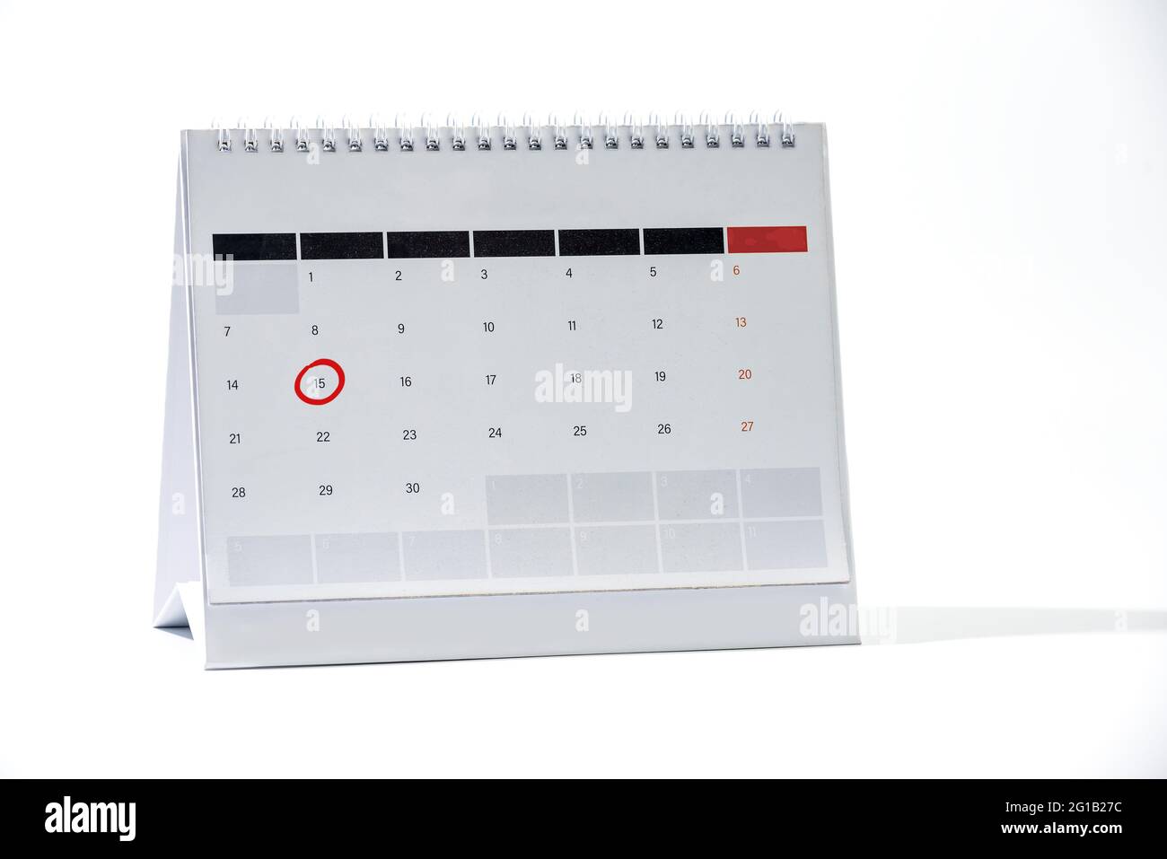 Red circle marked on calendar sheet. Mark on the calendar at 16. Date ...