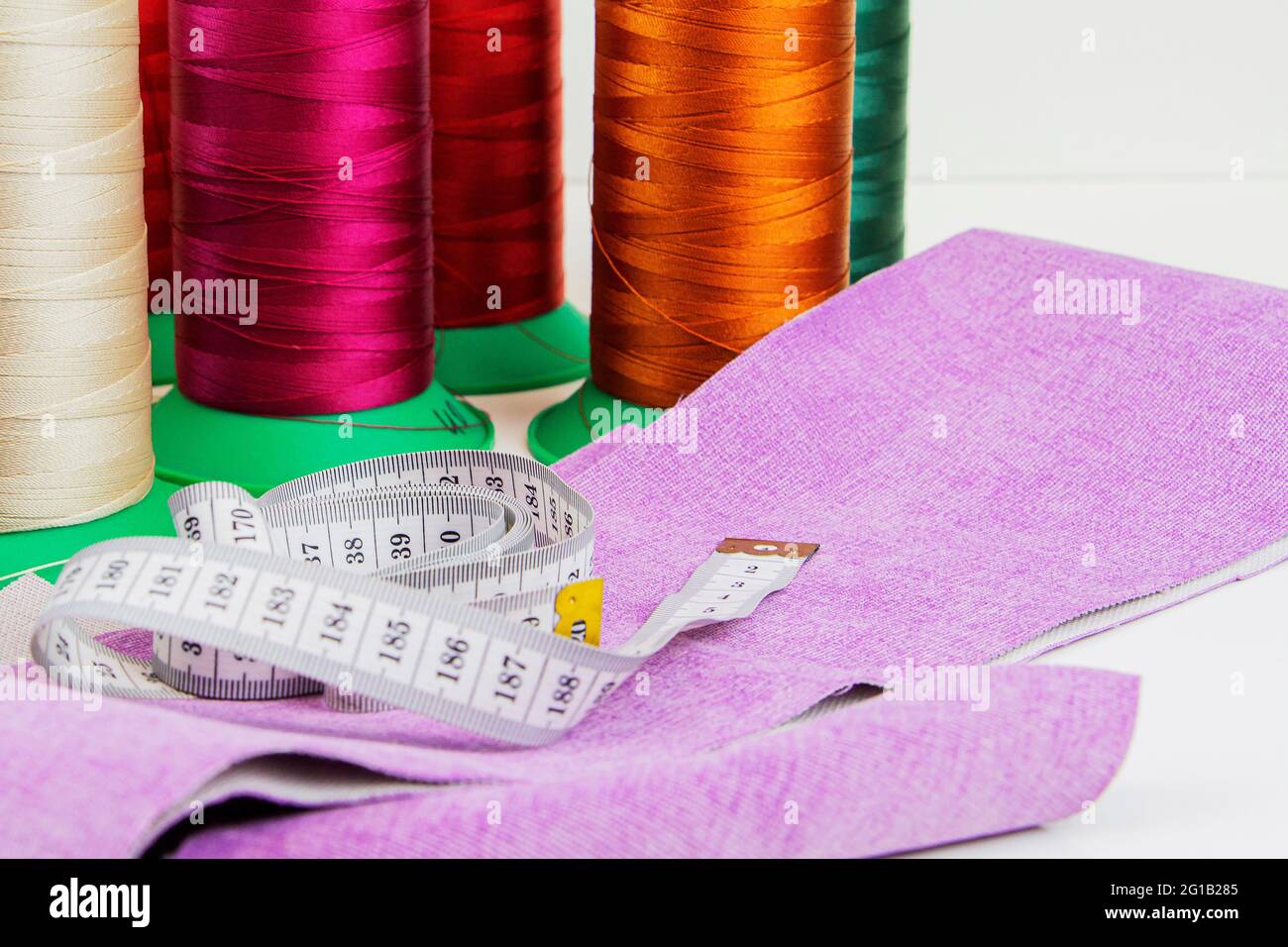 Pieces of cloth and thread. Tailoring, manufacture of upholstered ...