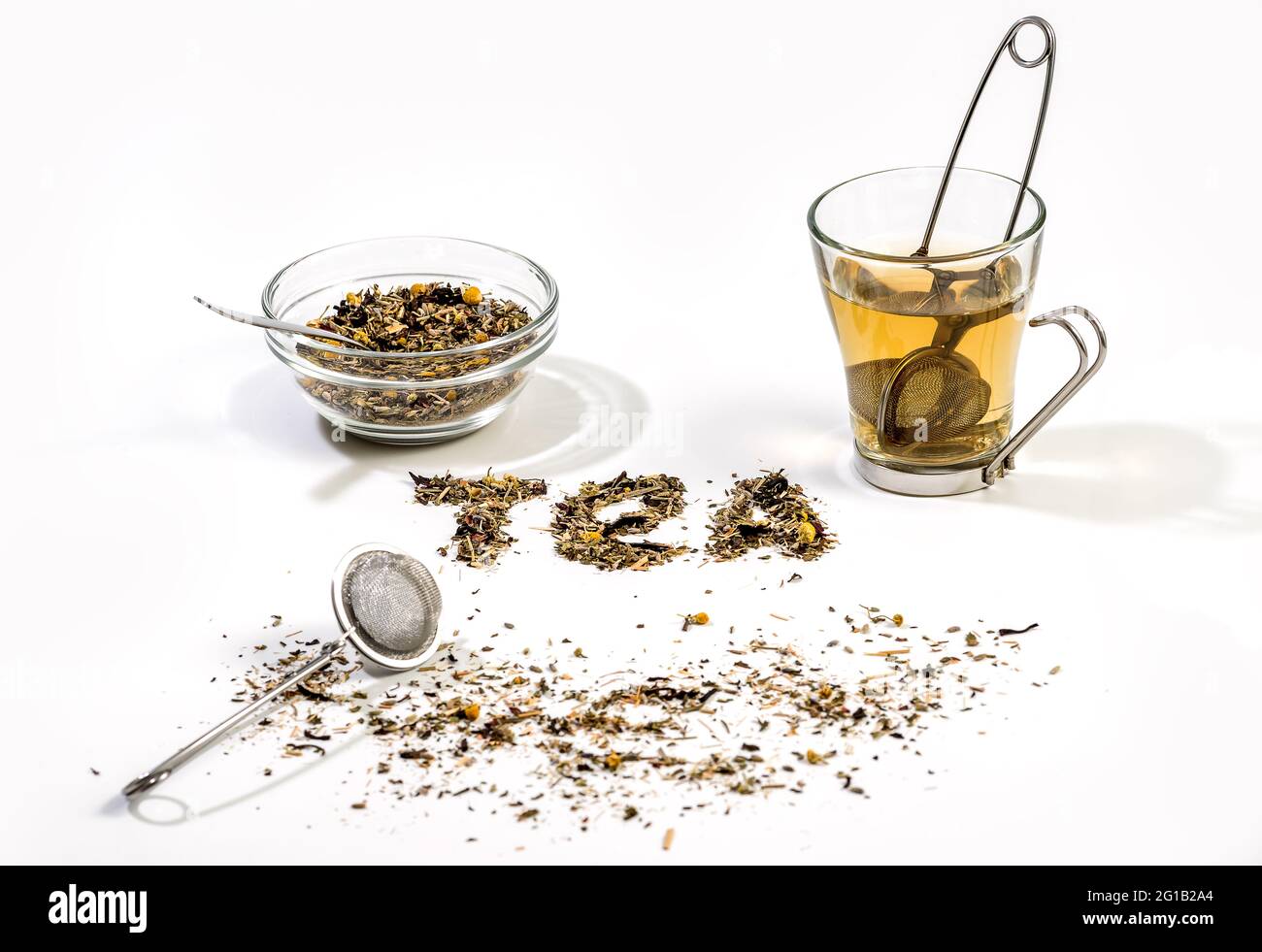 Tea text made by tea leaf on wwhite background surface with a bowl of ...