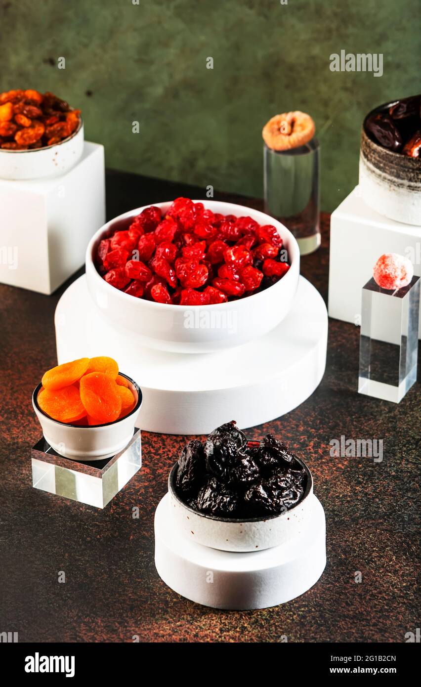 Healthy food snacks: natural dried fruits in bowls on rusty green ...