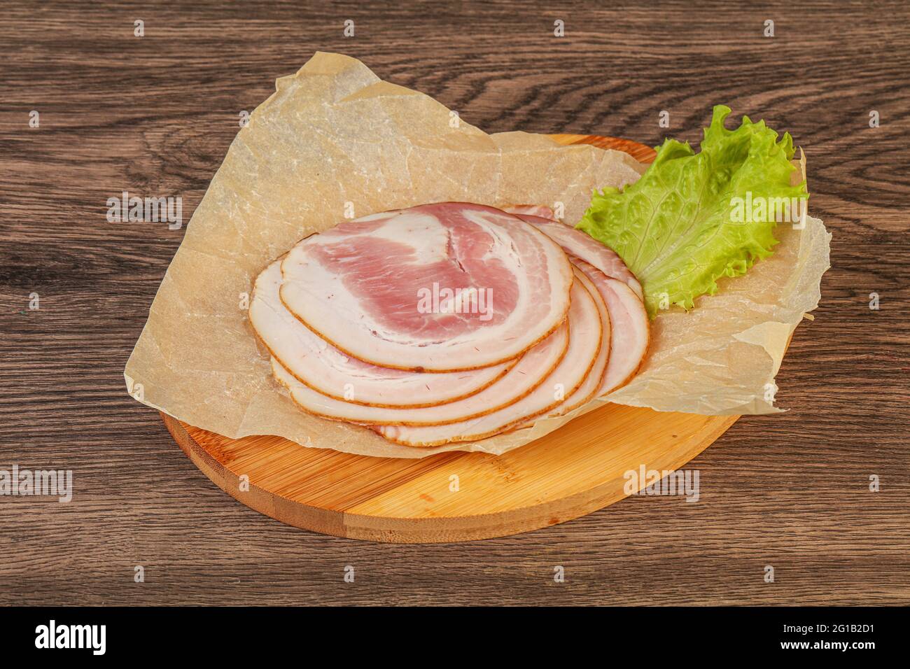 Sliced Italian Pancetta sausage over board Stock Photo - Alamy